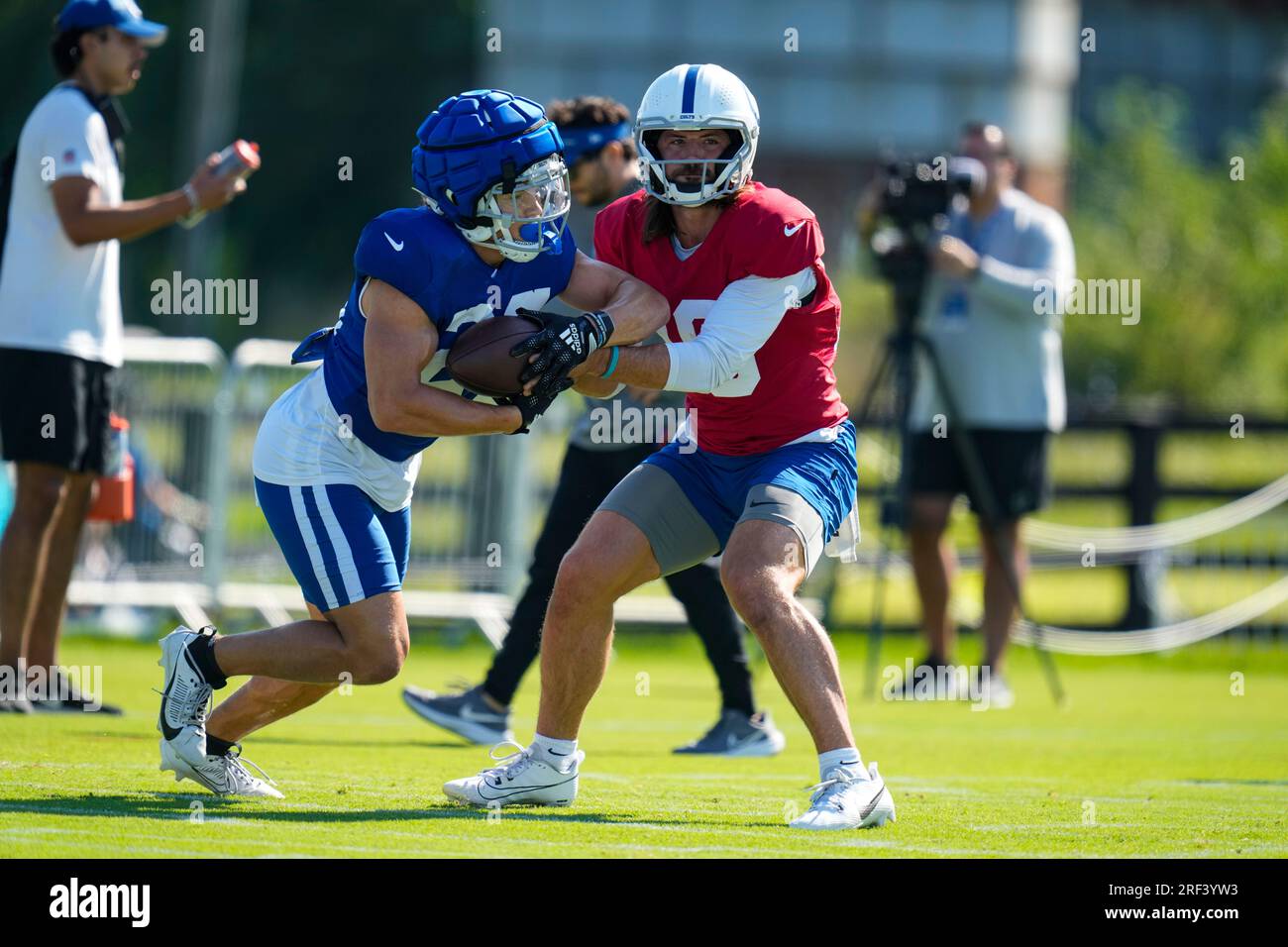 Indianapolis Colts quarterback Gardner Minshew II hands off to running ...