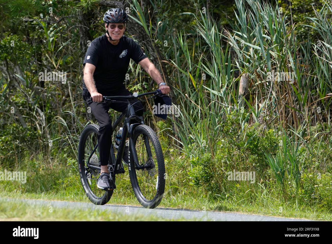 President Joe Biden goes on a bike ride in Gordons Pond State Park in ...