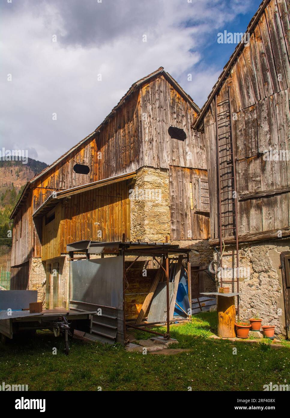 Historic wood and stone agricultural buildings in the mountain village ...