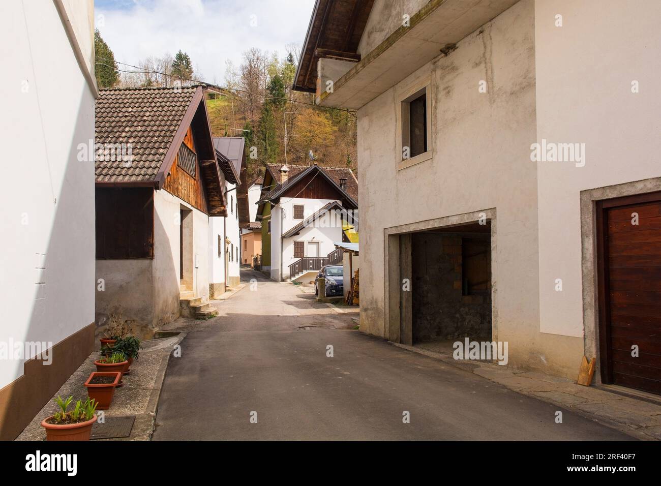 Historic stone houses in the mountain village of Mieli near Comeglians ...