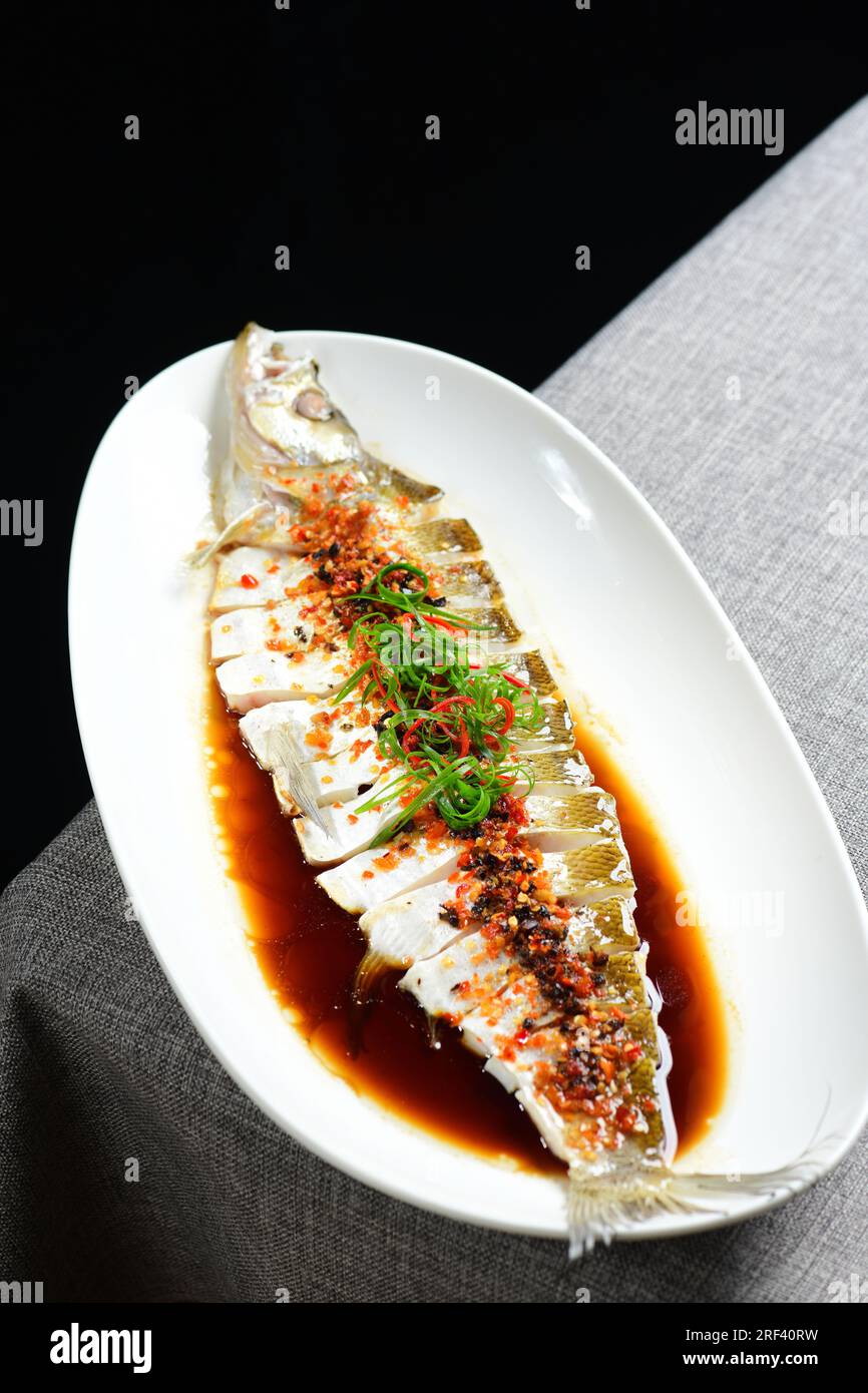 Steamed Topmouth culter fish with ham，Steamed white fish Stock Photo ...