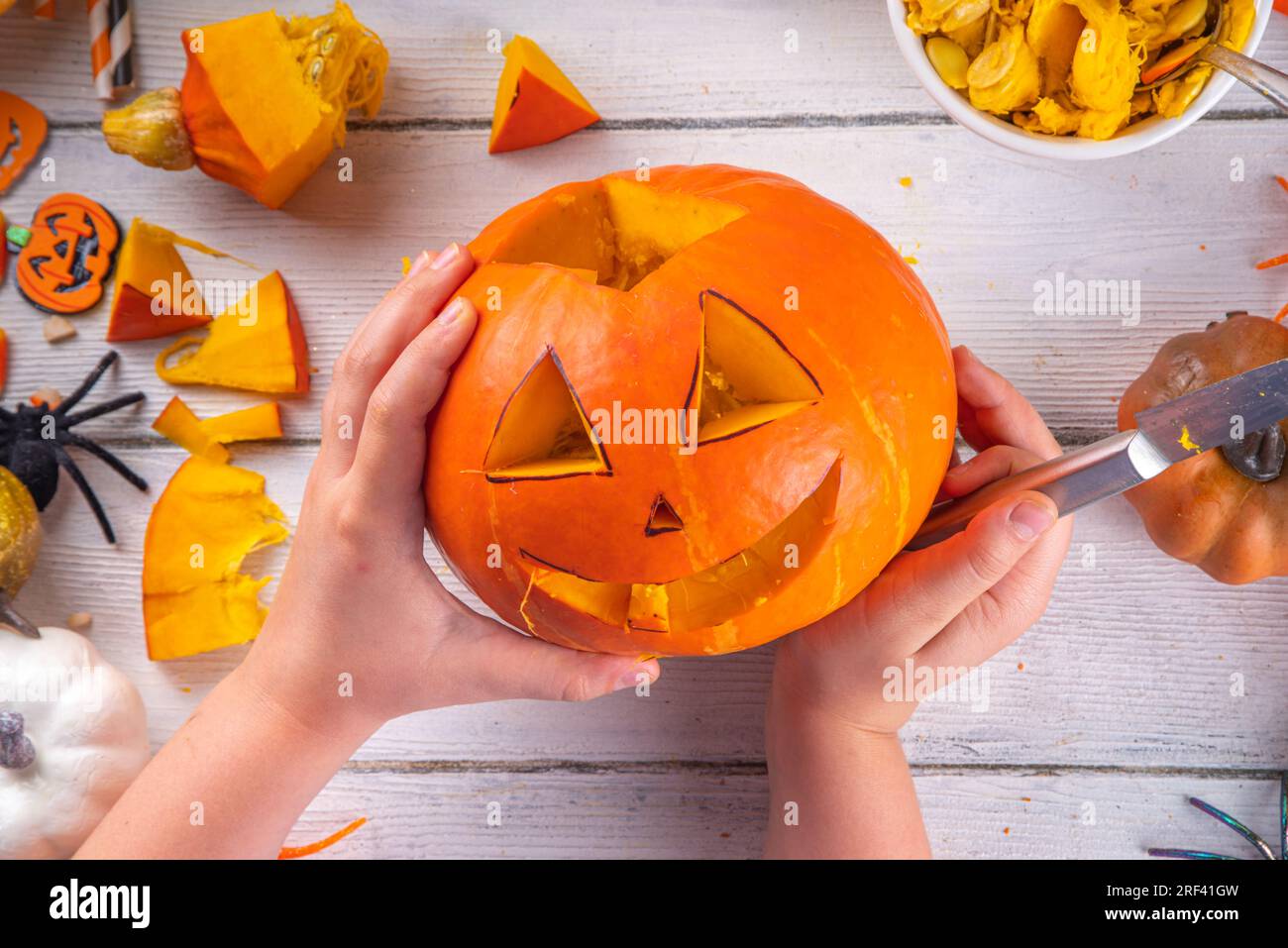Preparation for Halloween with carving cutting pumpkin Jack Lantern ...