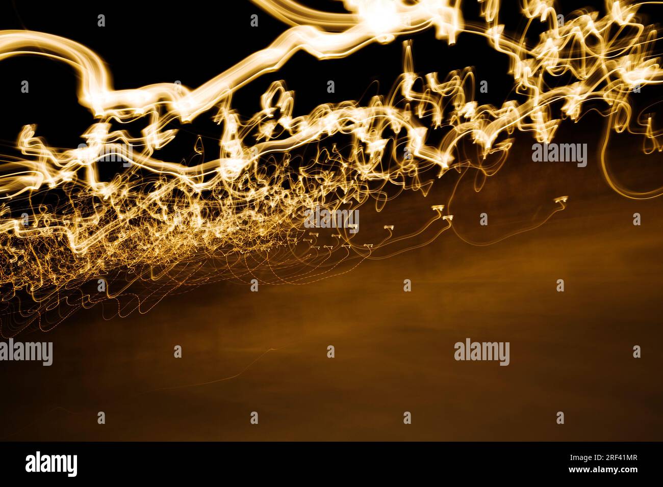 blurred multi colored surface from the rapid movement of glowing ...