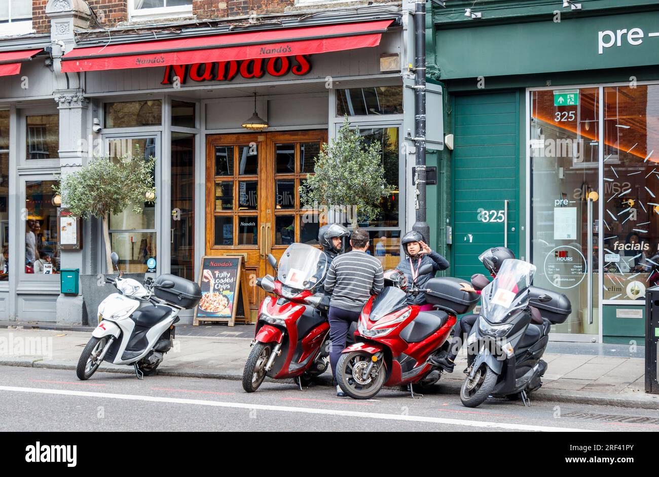 London street scene motorbike hi-res stock photography and images - Alamy