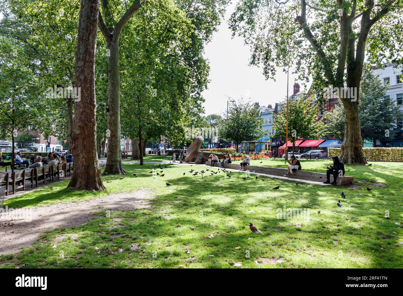 People relaxing in Islington Green, a small park at the junction of ...