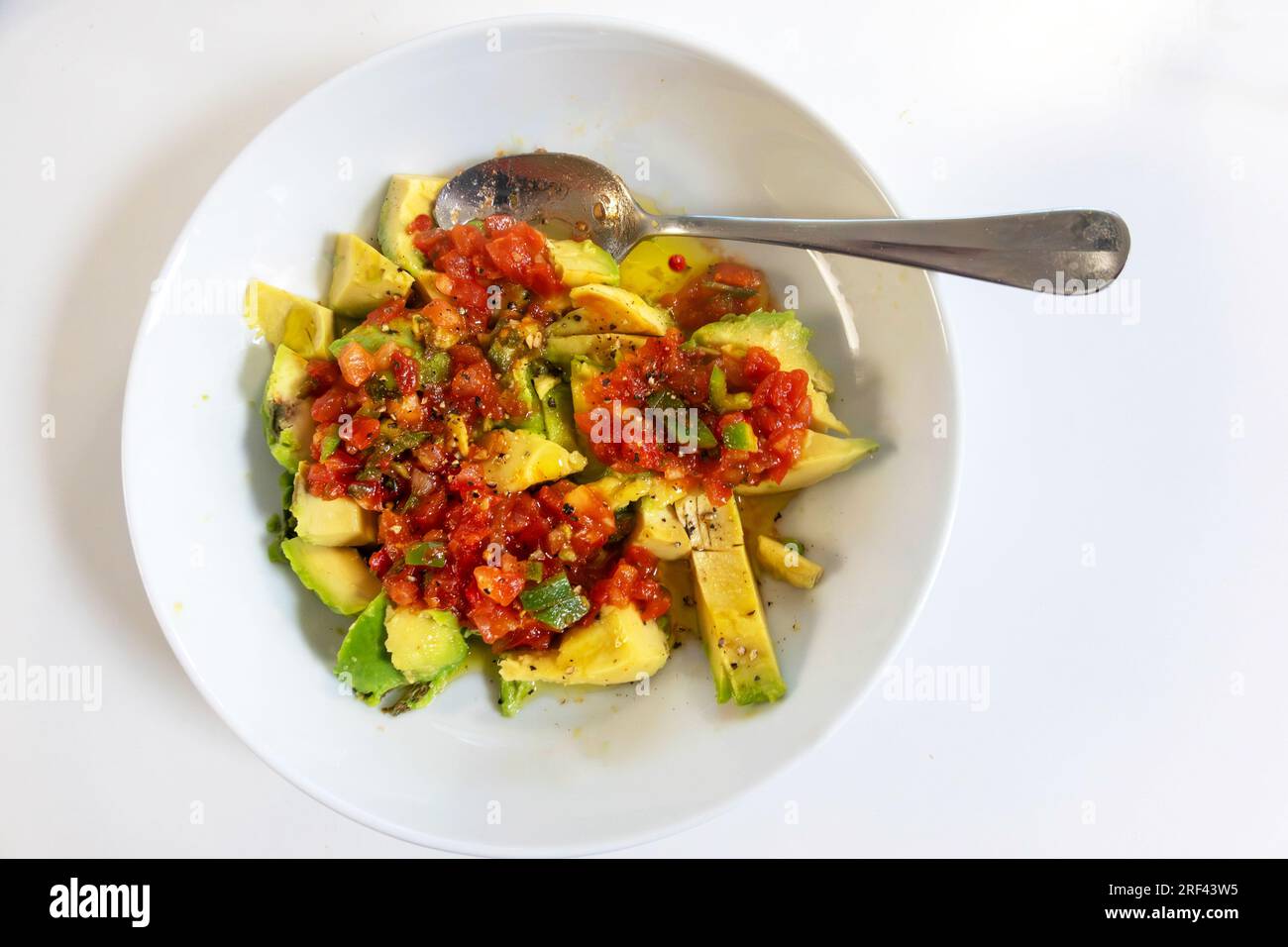 Smashed avocado with spicy Mexican salsa Stock Photo - Alamy