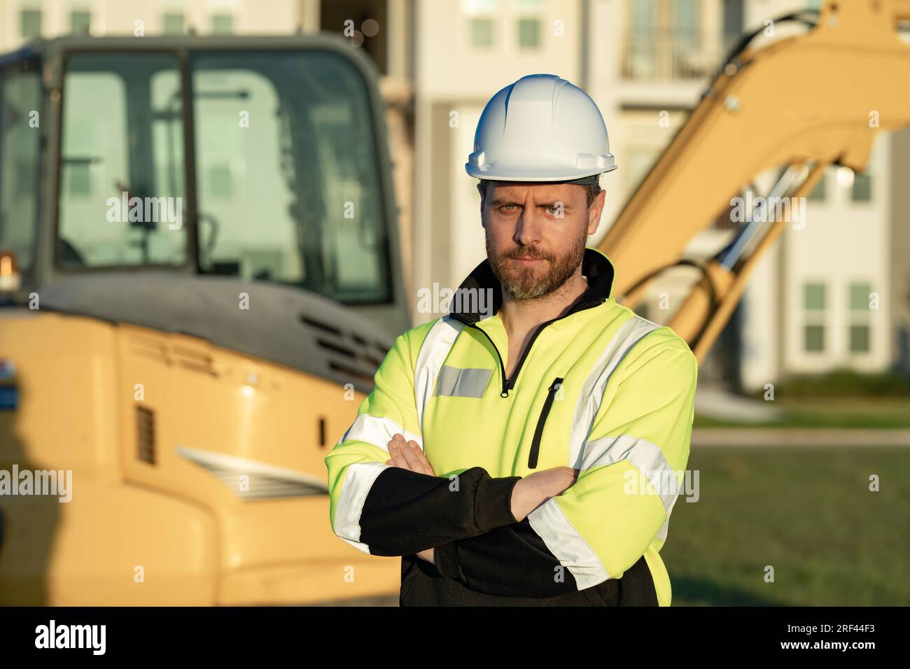 Worker with bulldozer on site construction. Man excavator worker ...