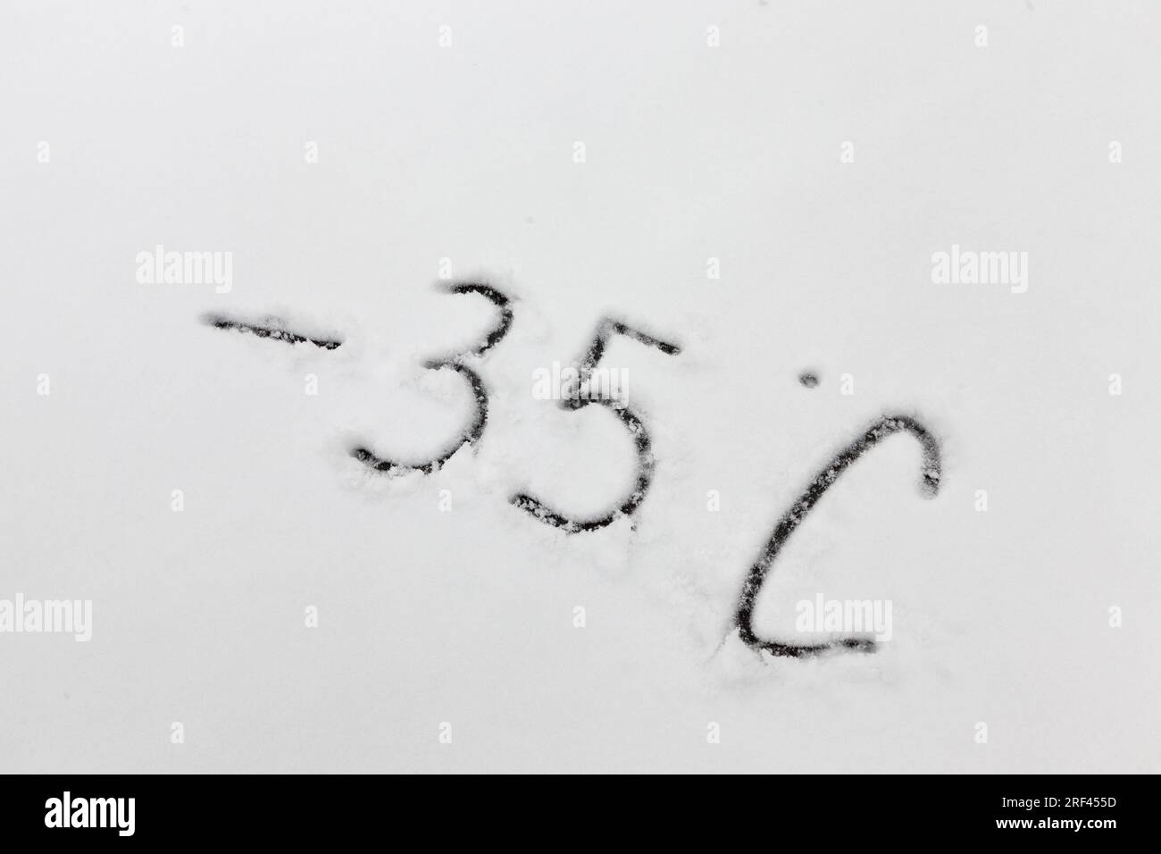 drawn on the snow, temperature symbols denoting negative very cold ...