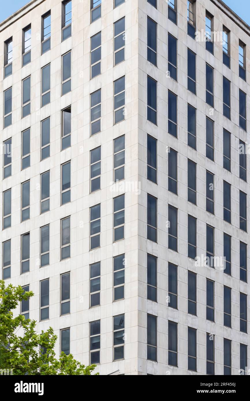 facade of an office building with marble tiles and multiple similar ...