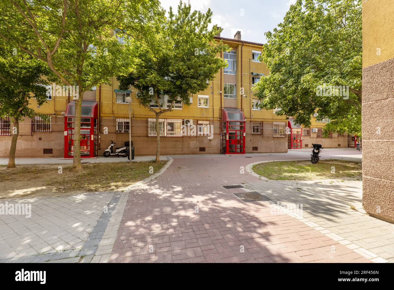 A modest neighborhood of four-story urban residential buildings with ...