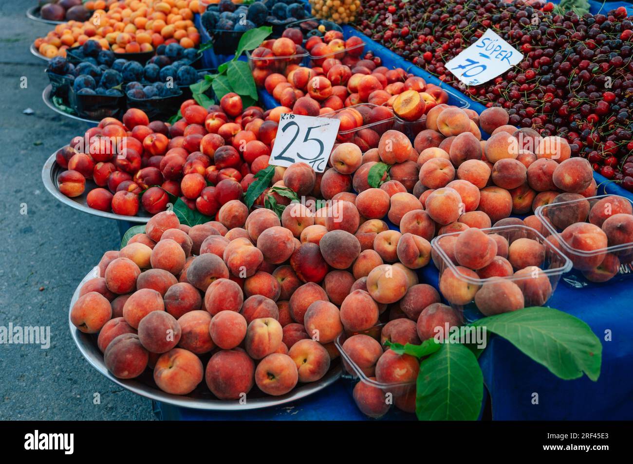 Nectarine sale in the traditional farm Turkish market, a counter filled ...