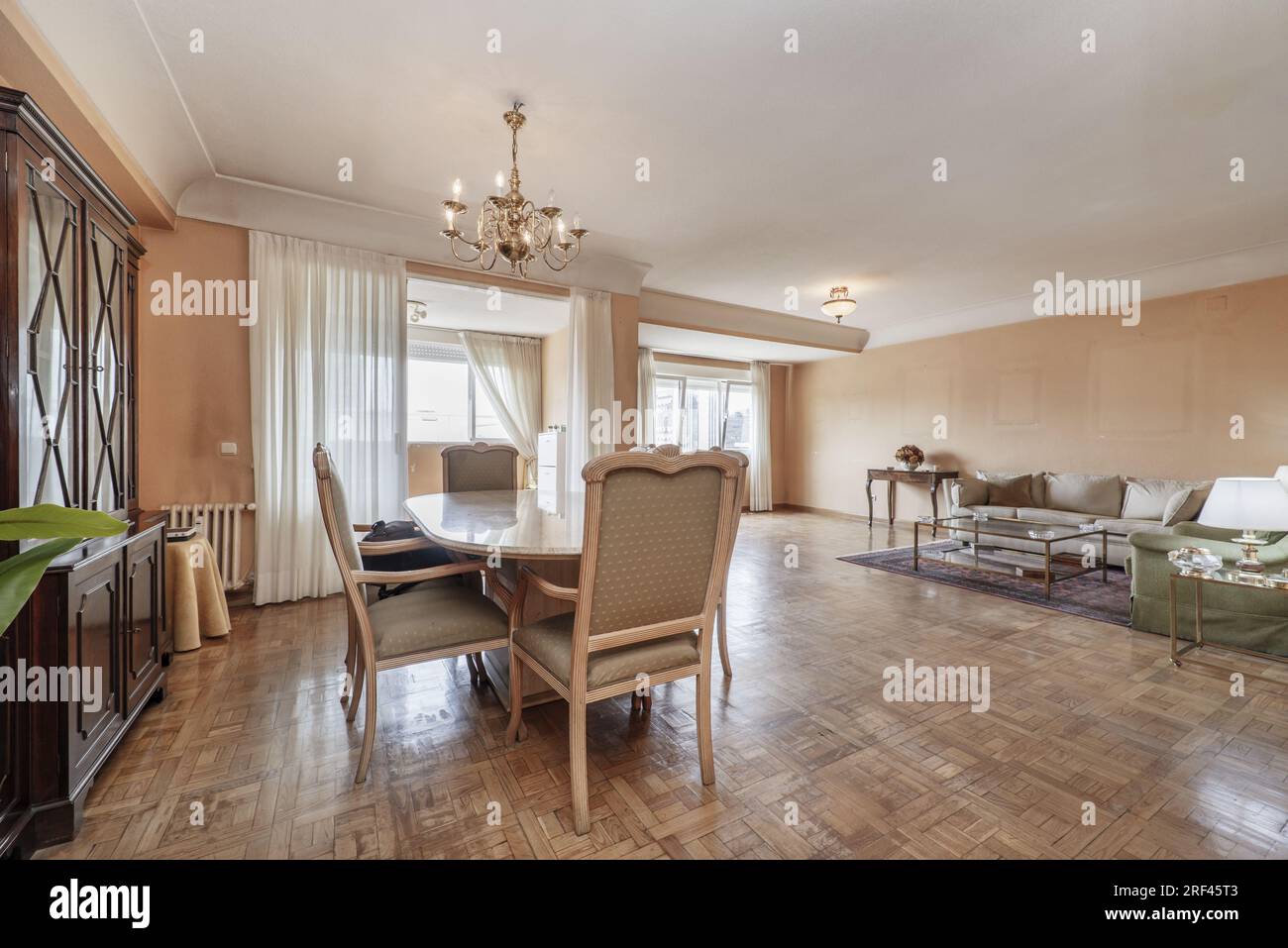 Spacious living room of a house with parquet floors in need of stabbing ...