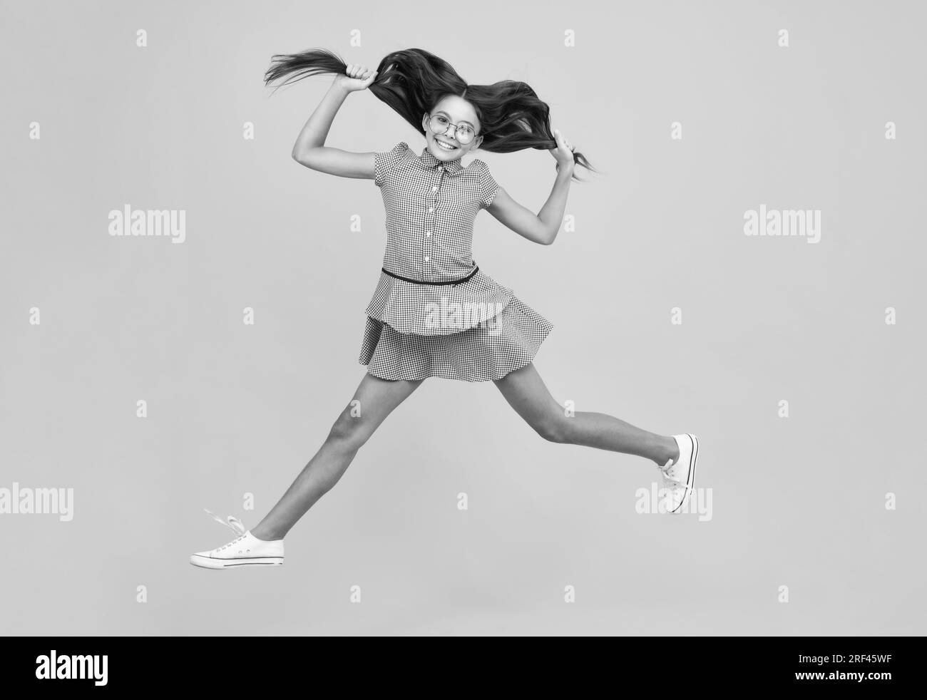 Happiness, activity and child. Teenager girl jumping on isolated ...