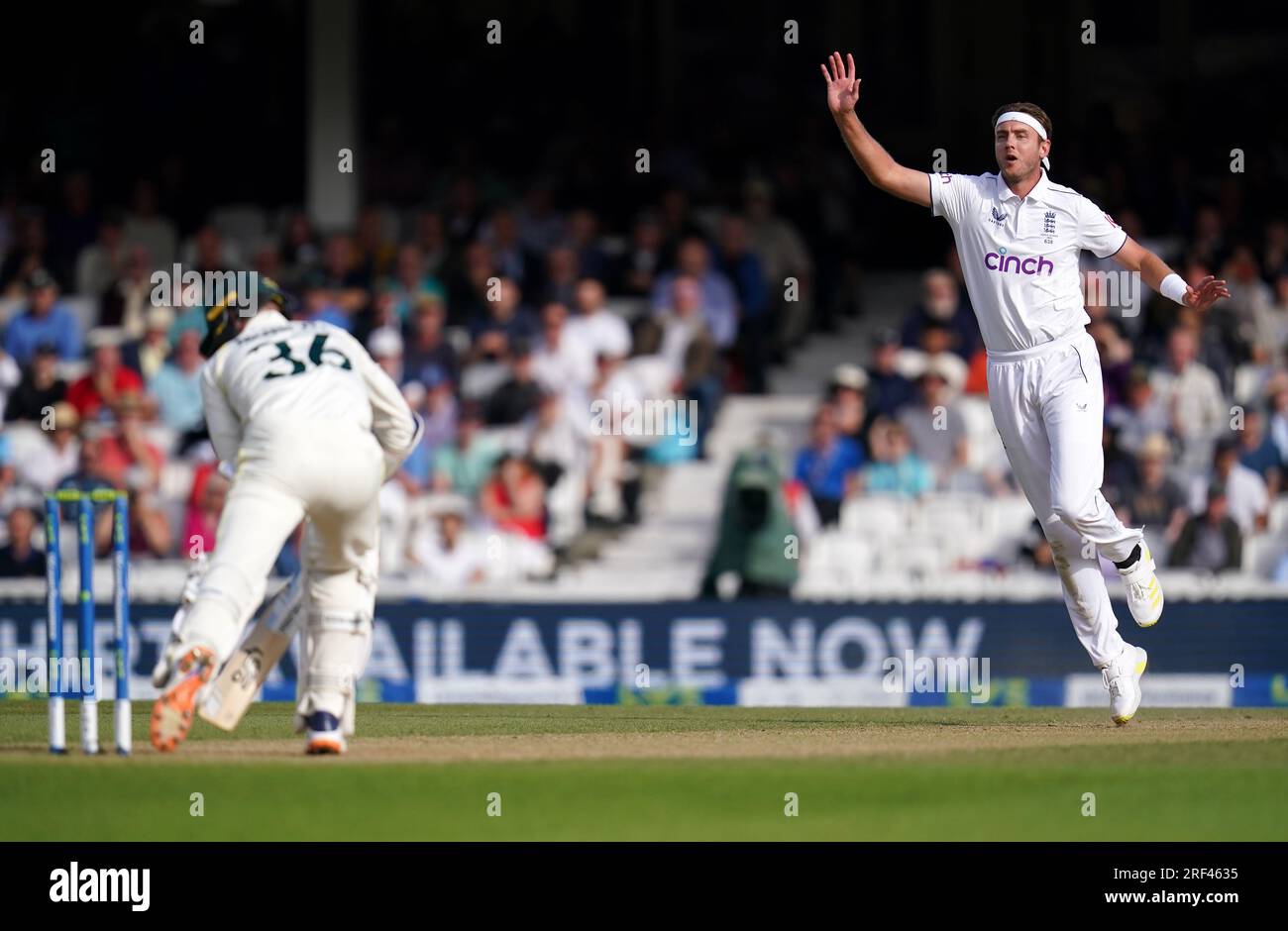 England's Stuart Broad (right) reacts after bowling to Australia's Todd ...