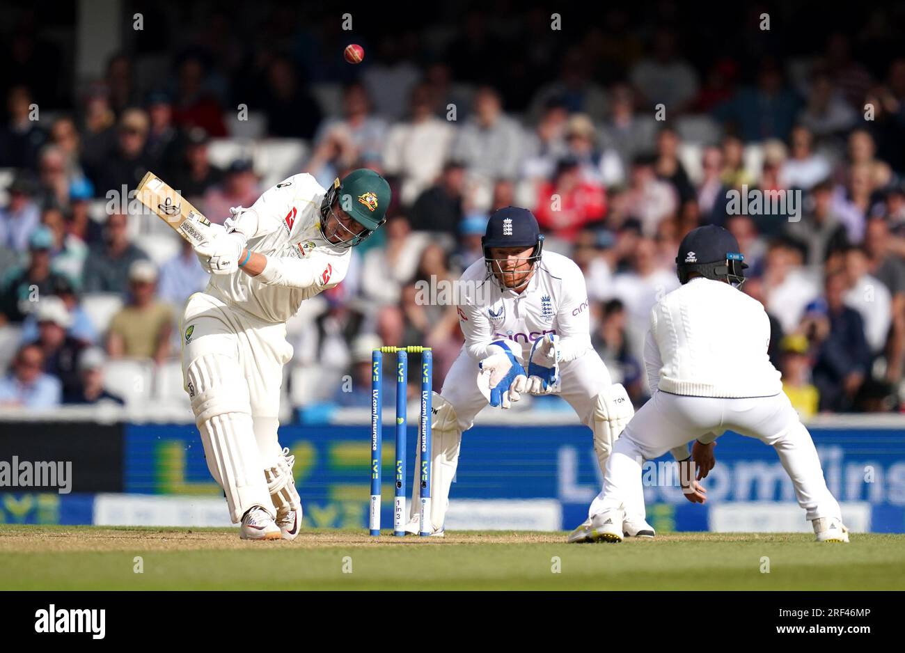 Australia's Todd Murphy (left) hits the ball from England's Moeen Ali ...