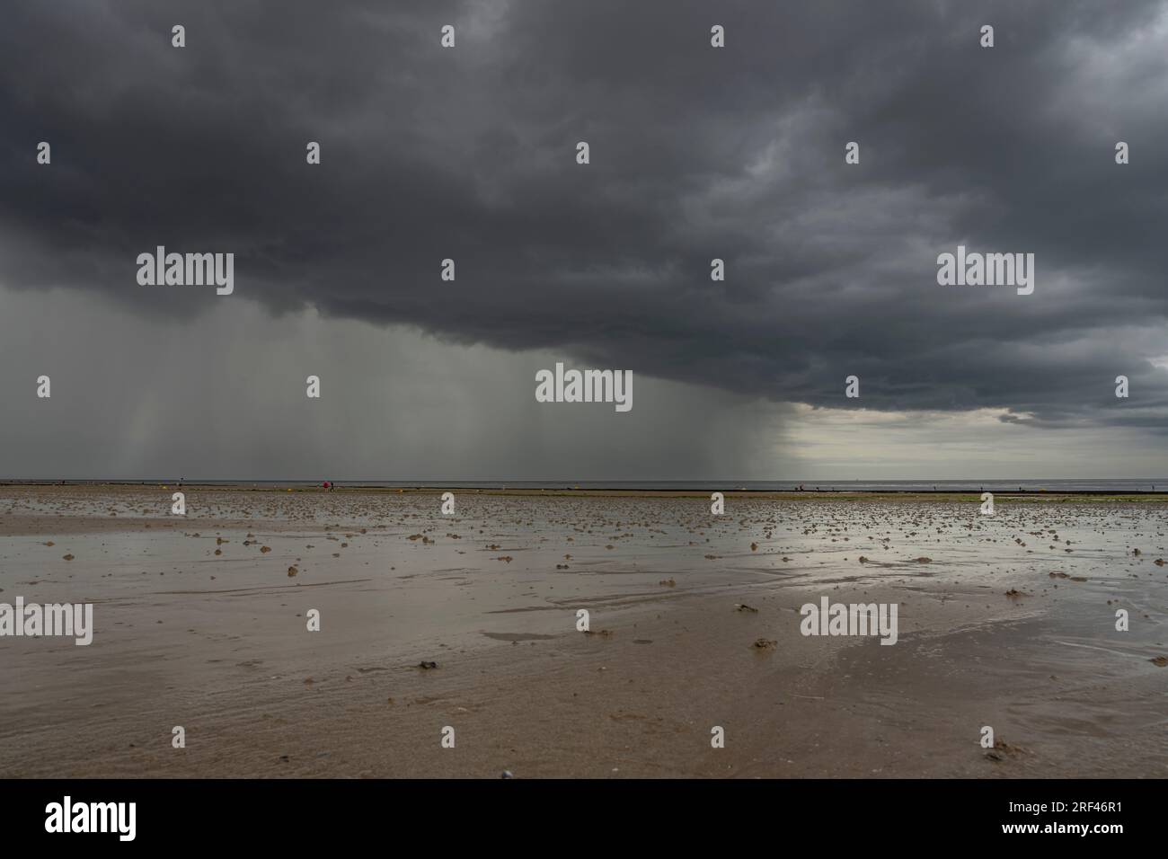View of a cloudy rainy sky above the sea from the beach Stock Photo - Alamy