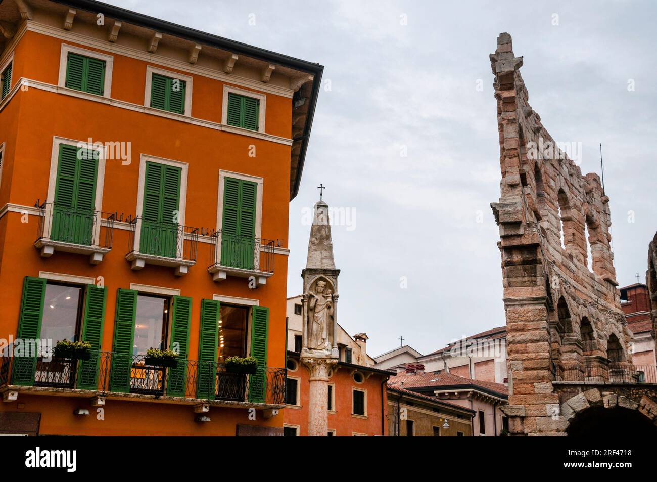 Wall of the Verona Arena and monument Colonna con capitelli in Verona ...