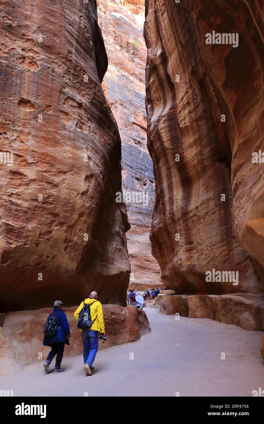 People walking along the Al-Siq, the Main Entrance Canyon to Petra ...