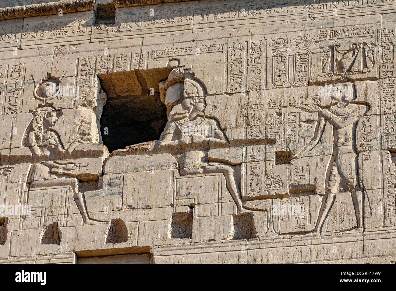 Carvings of a Ptolemaic pharaoh making offerings to the gods on the ...