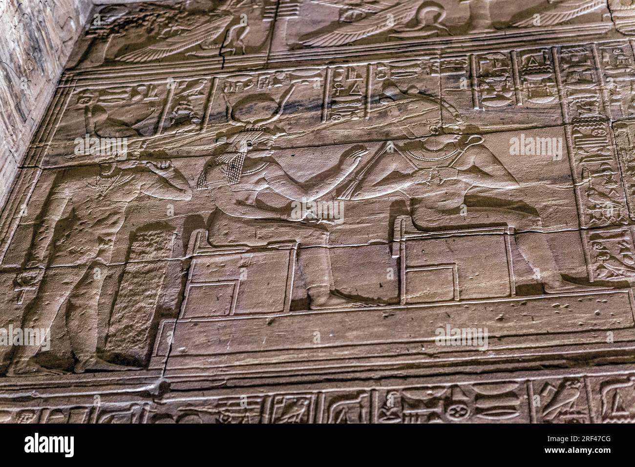 Seated figures of Isis and Osiris in the Temple of Isis at Philae Stock ...