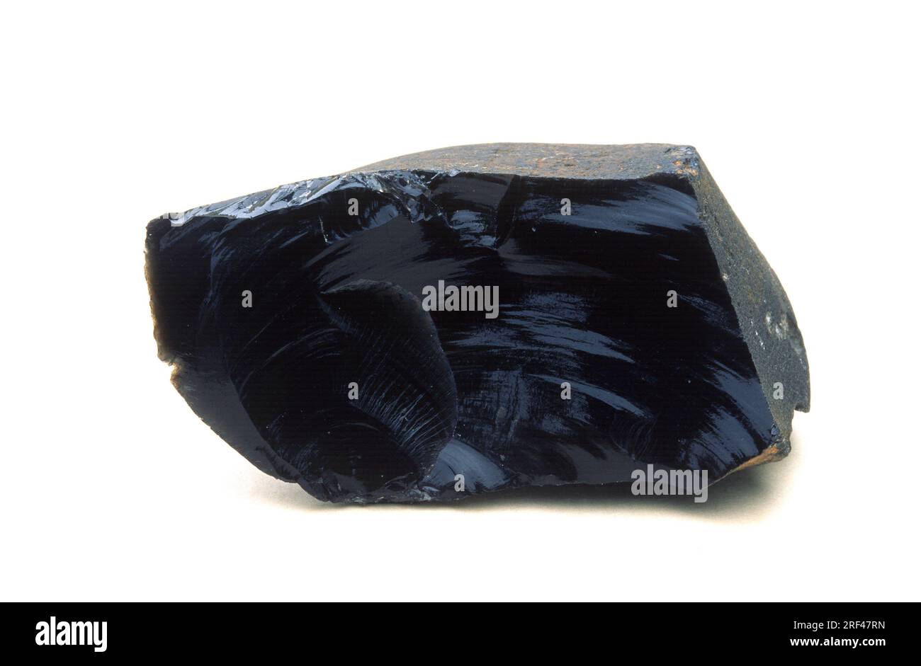 Obsidian is a volcanic glass rock with conchoidal fracture. This sample ...