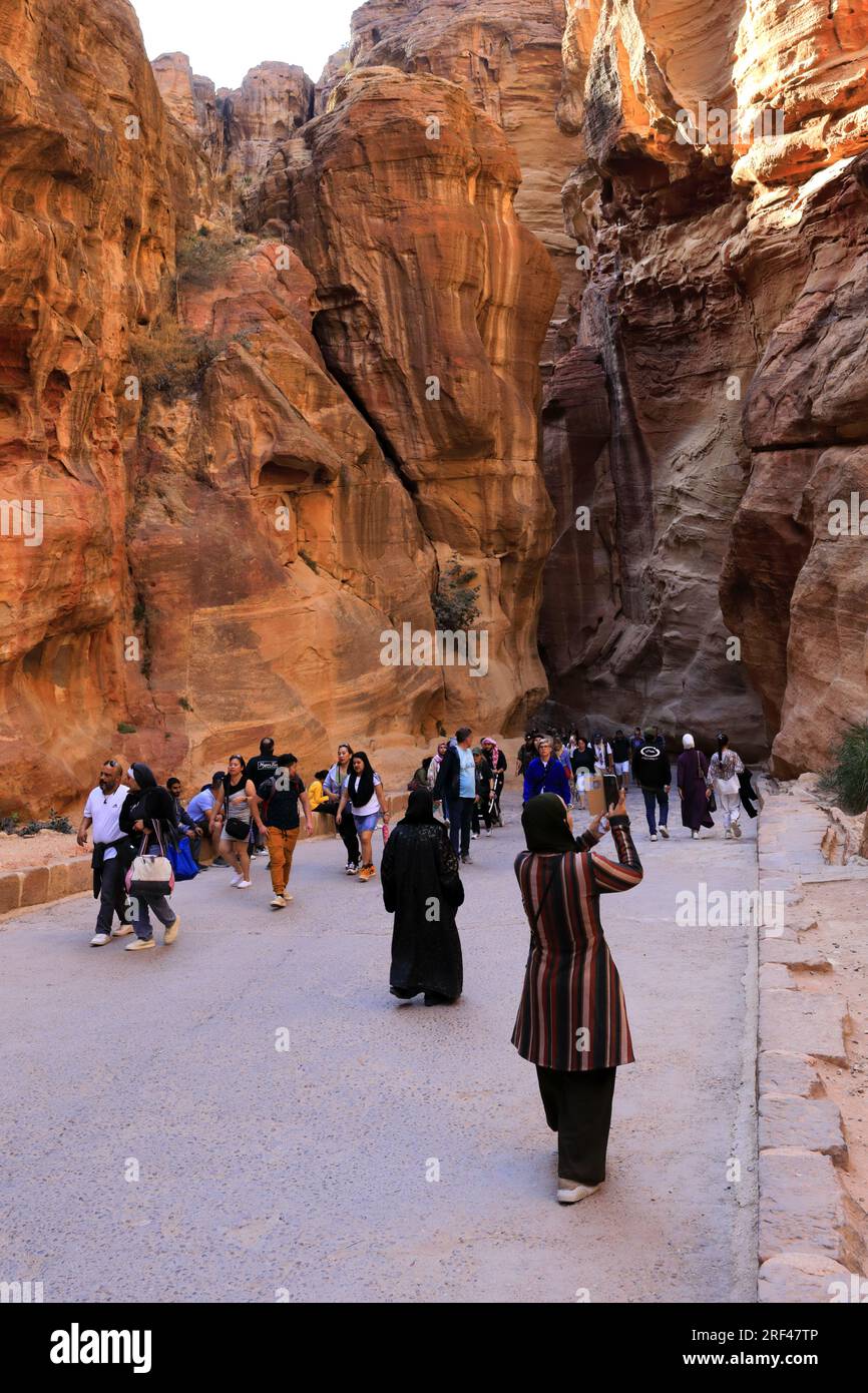 People walking along the Al-Siq, the Main Entrance Canyon to Petra ...