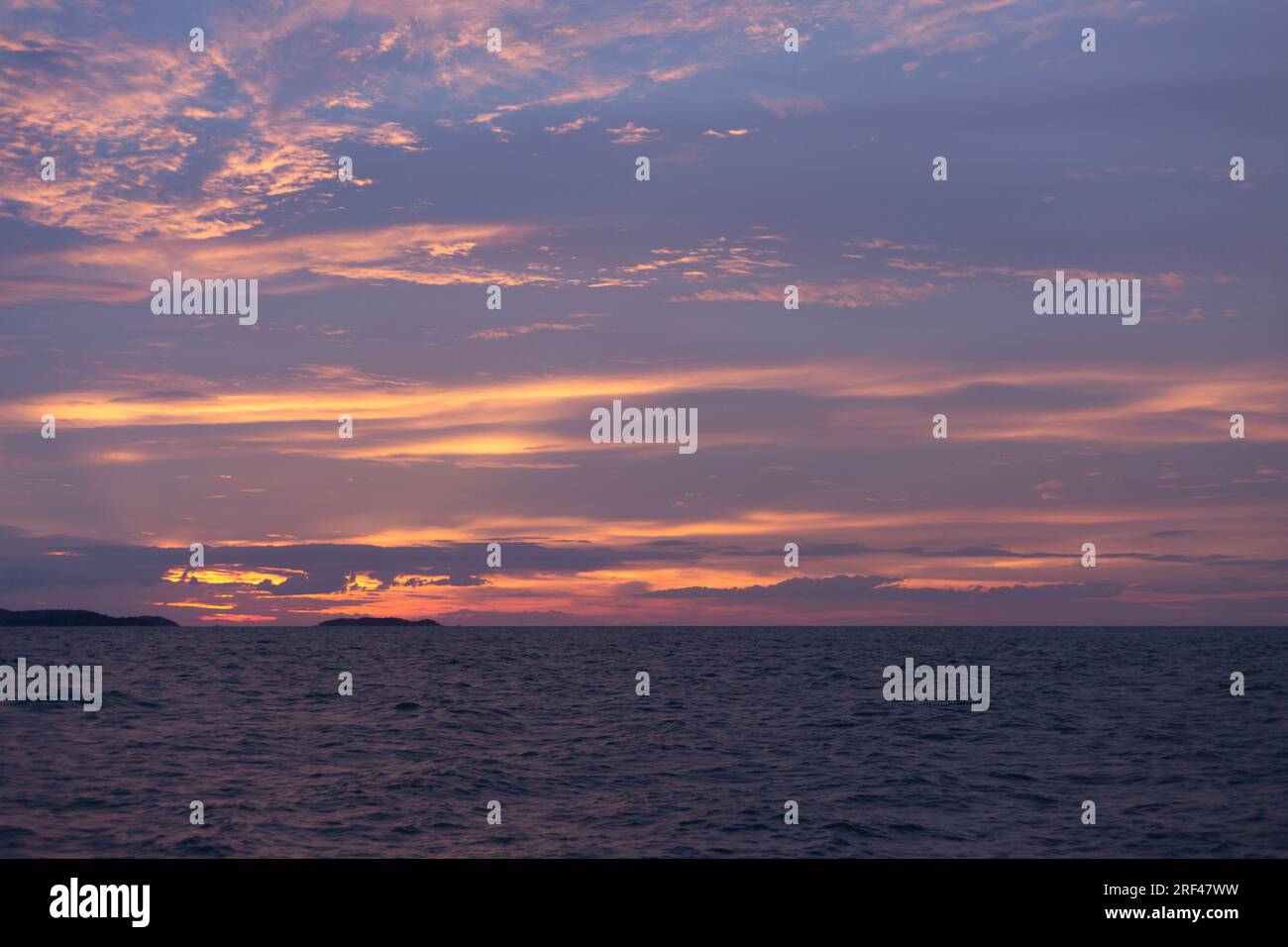 Raging Sea with Sunset Sky Background Stock Photo - Alamy