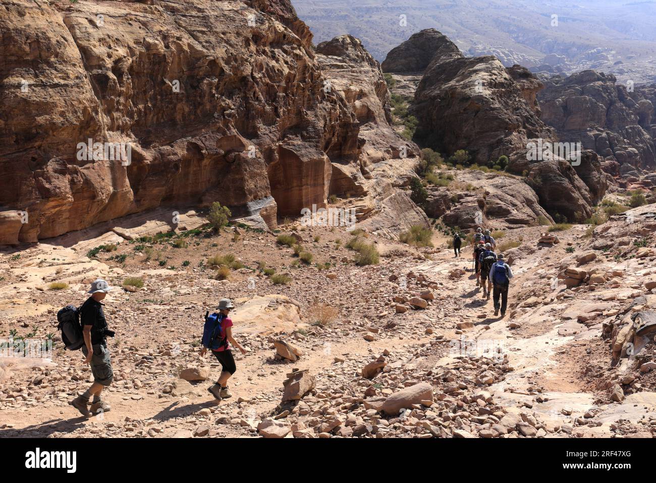 People on the Al Khubtha trail down to Petra city, UNESCO World ...