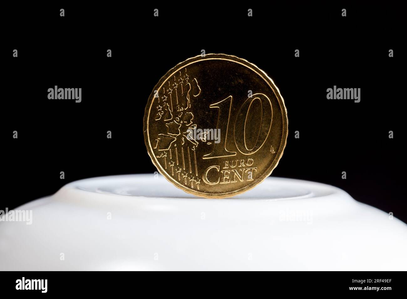 ten euro cents on a glass plate turned upside down, shiny old EU 10 ...