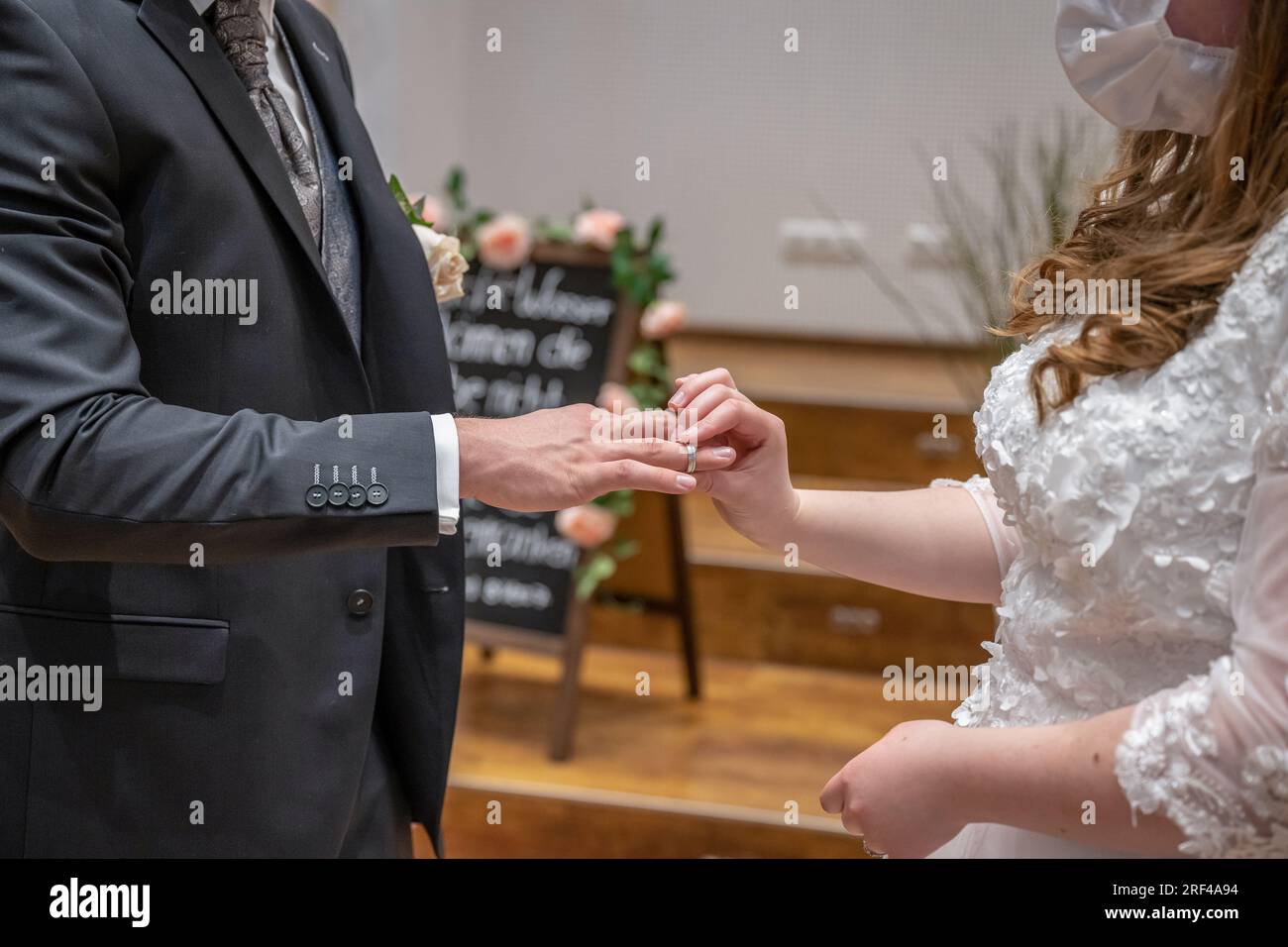wedding rings and hands of bride and groom ring exchange couple at ...