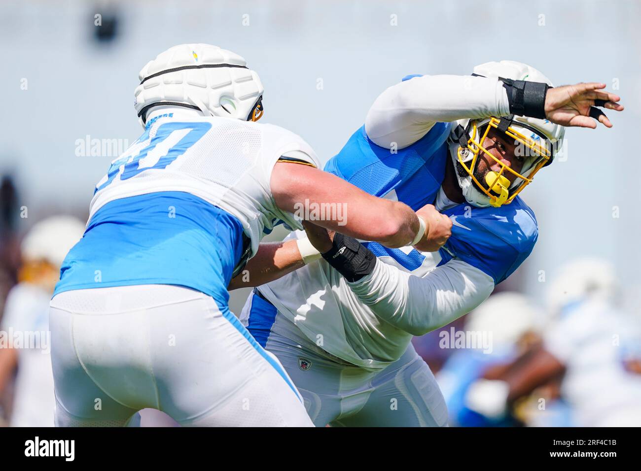 From left, Los Angeles Chargers center Isaac Weaver and defensive ...