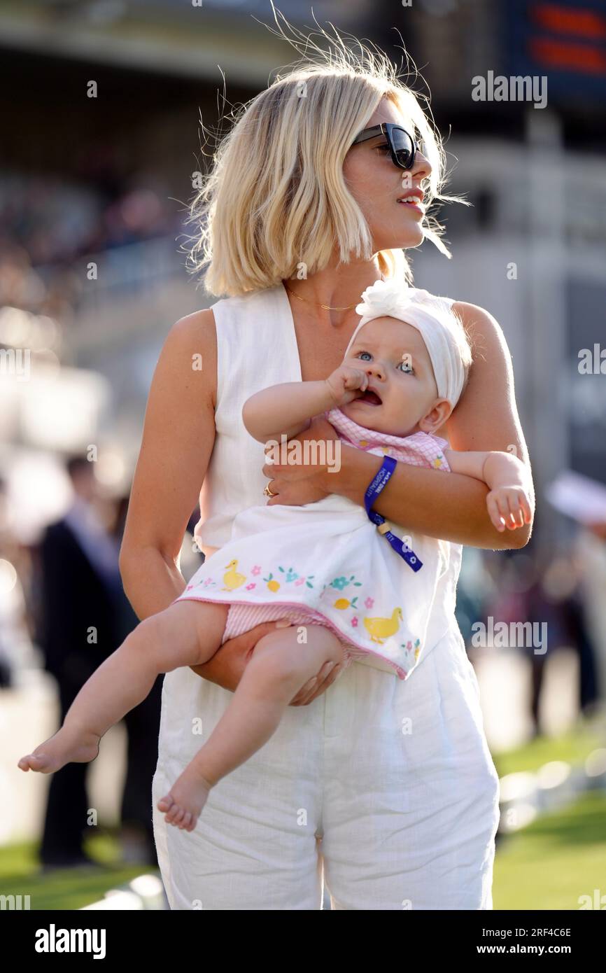 Mollie King, the partner of England's Stuart Broad, with their daughter ...