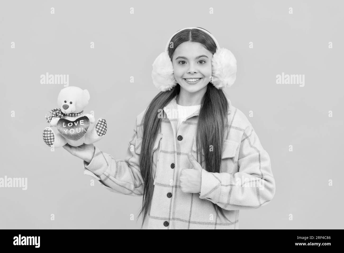 Happy kid hold teddy bear valentines toy gift showing approval sign ...