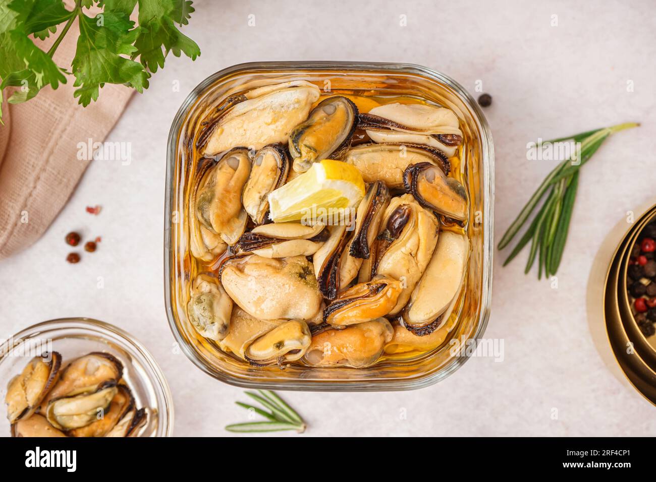 Bowls with pickled mussels on white background Stock Photo - Alamy