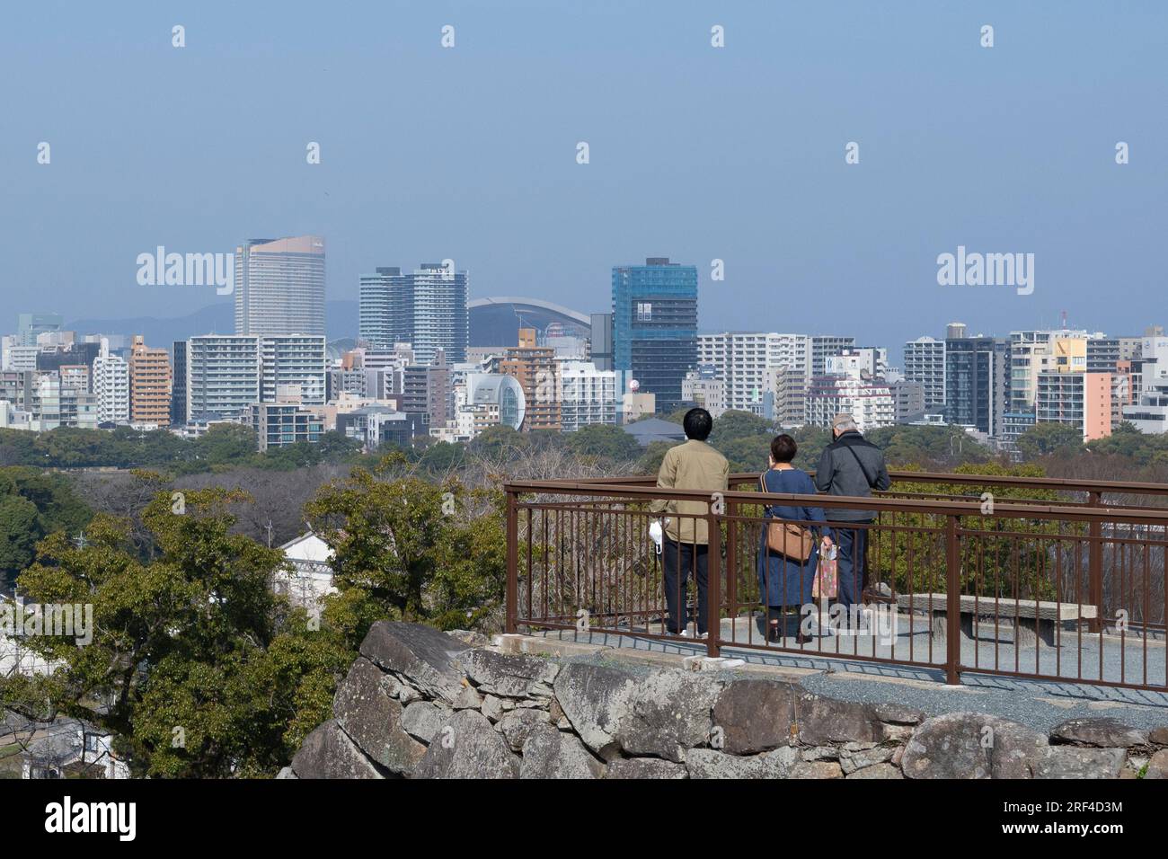 Fukuoka, Japan. 11th Mar, 2023. A family takes in the skyline views of ...
