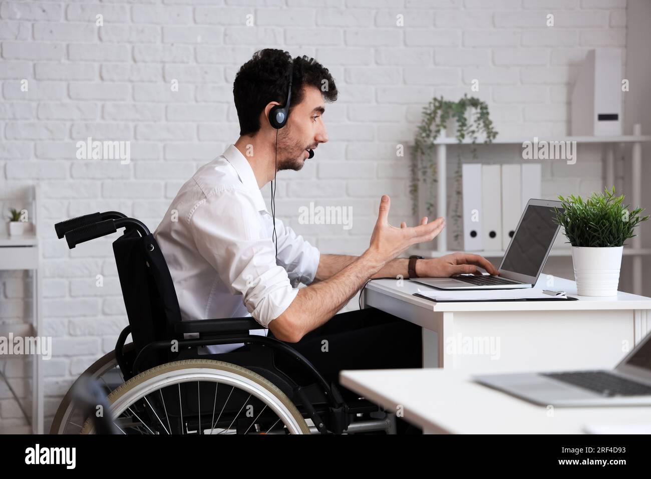 Male office manager disability working hi-res stock photography and ...