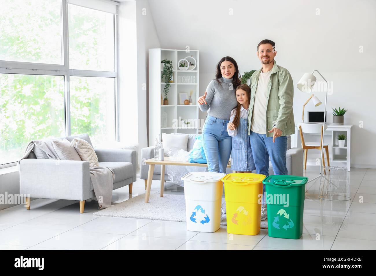 Family with recycle bins at home Stock Photo - Alamy