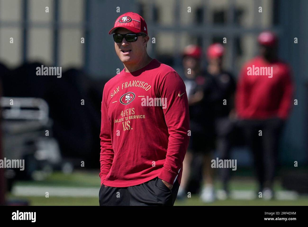 San Francisco 49ers general manager John Lynch watches as players take ...