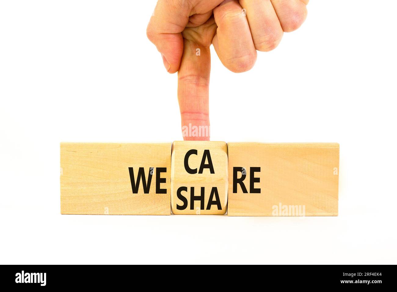 We share and care symbol. Concept word we share we care on wooden block ...