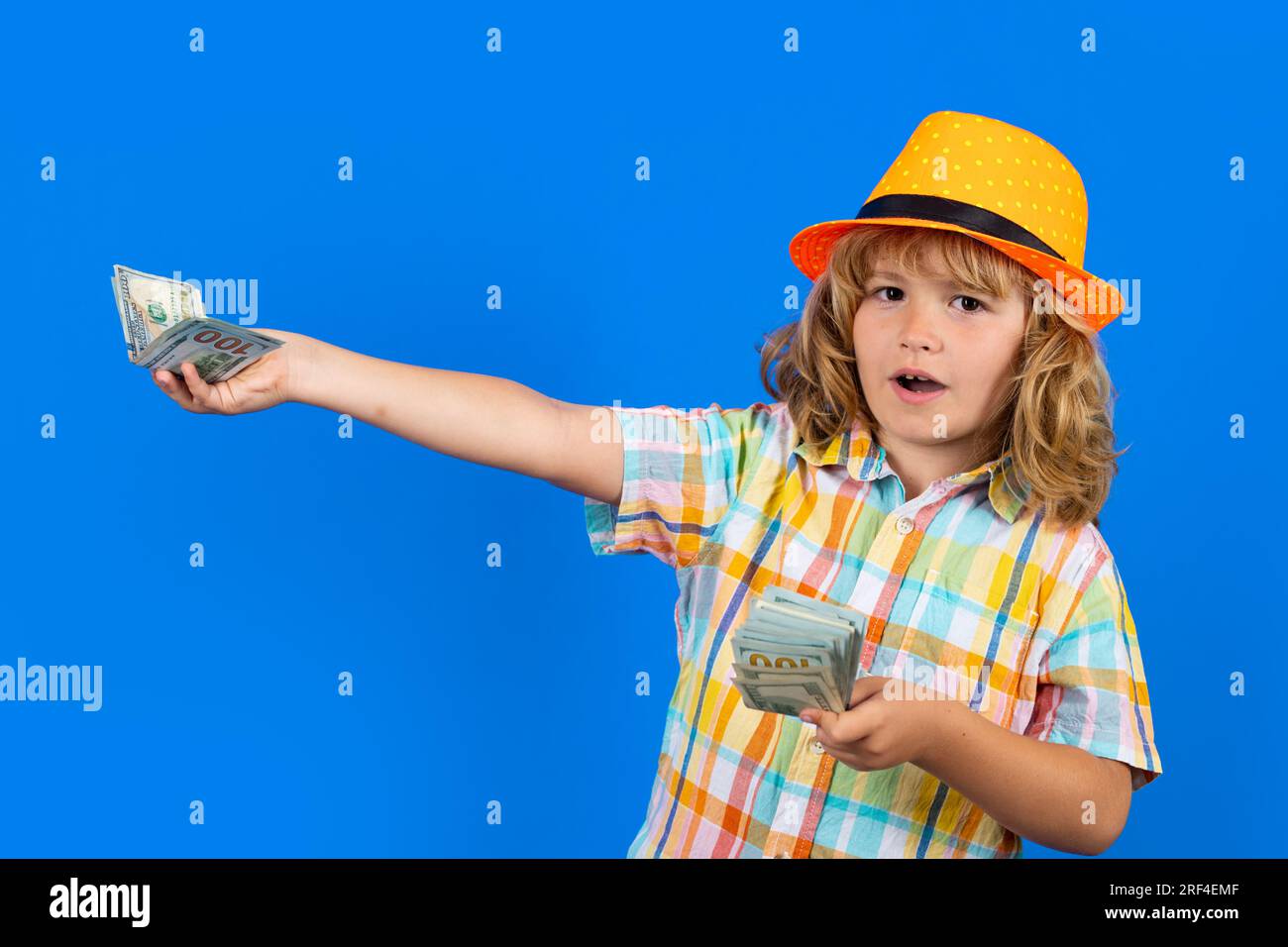 Cash money dollars bills. Studio portrait of child with money banknotes ...