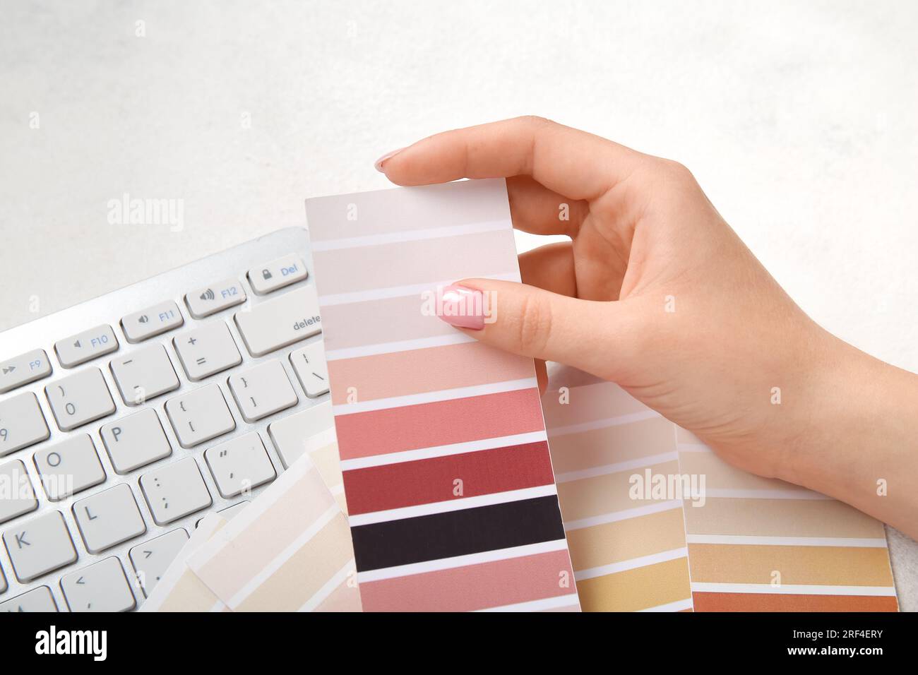 Female hand, color palettes and PC keyboard on light background Stock ...