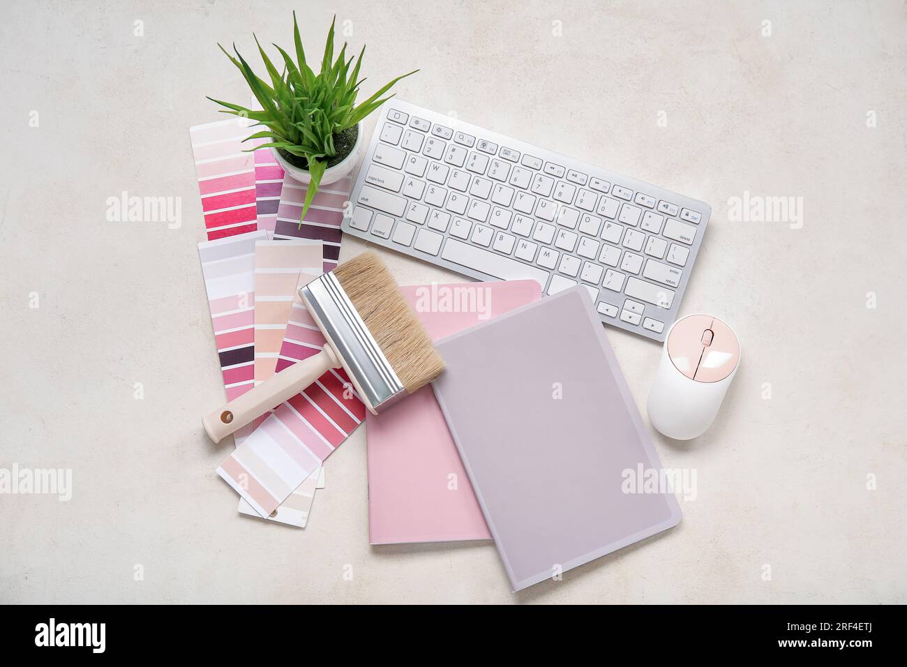 Many color palettes, PC keyboard, brush and notebooks on light ...