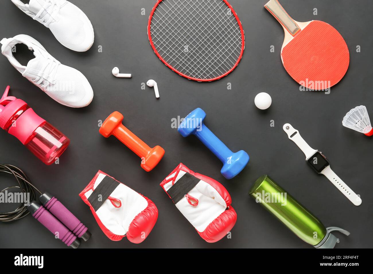 Set of sports equipment with gadgets on dark background Stock Photo - Alamy