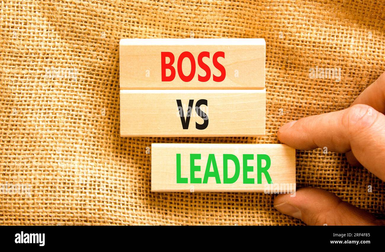 Boss vs leader symbol. Concept words Boss vs versus leader on wooden ...