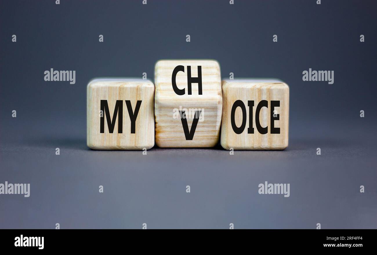 My voice and choice symbol. Businessman turns wooden cubes and changes ...