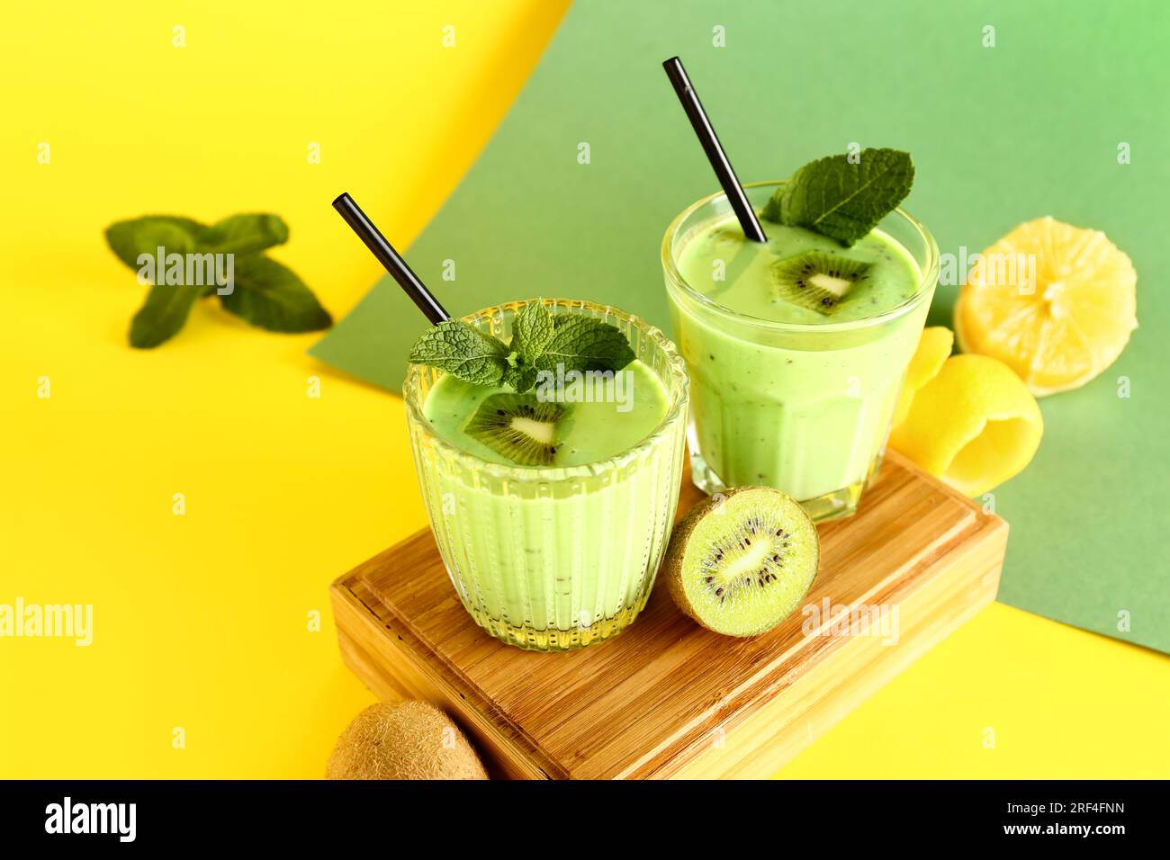 Glasses Of Fresh Kiwi Smoothie With Mint And Lemon On Colorful