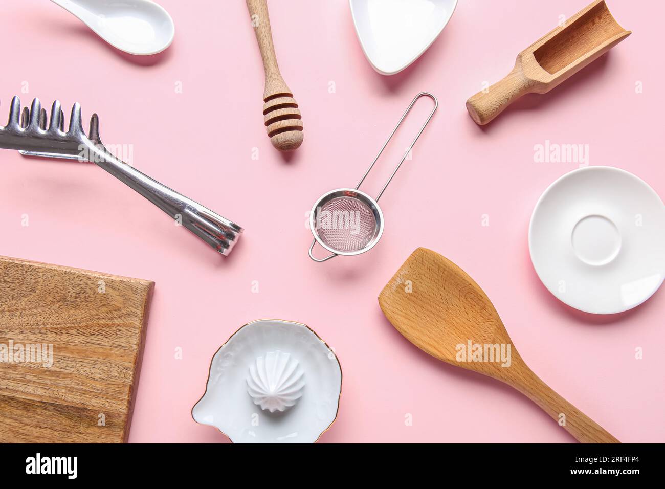 Composition with different kitchen utensils on pink background Stock ...