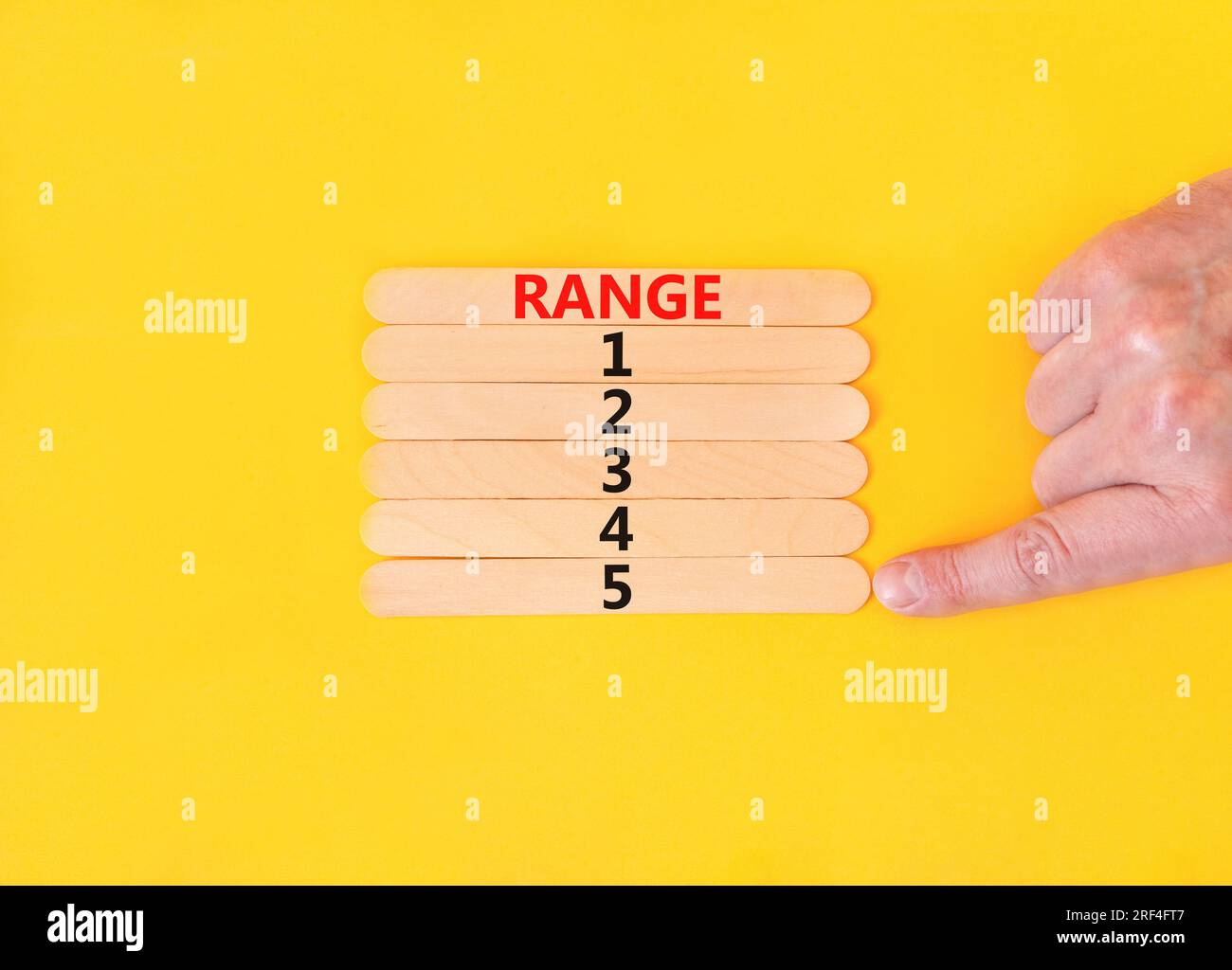 Time to range 5 symbol. Concept word Range 1 2 3 4 5 on wooden sticks ...