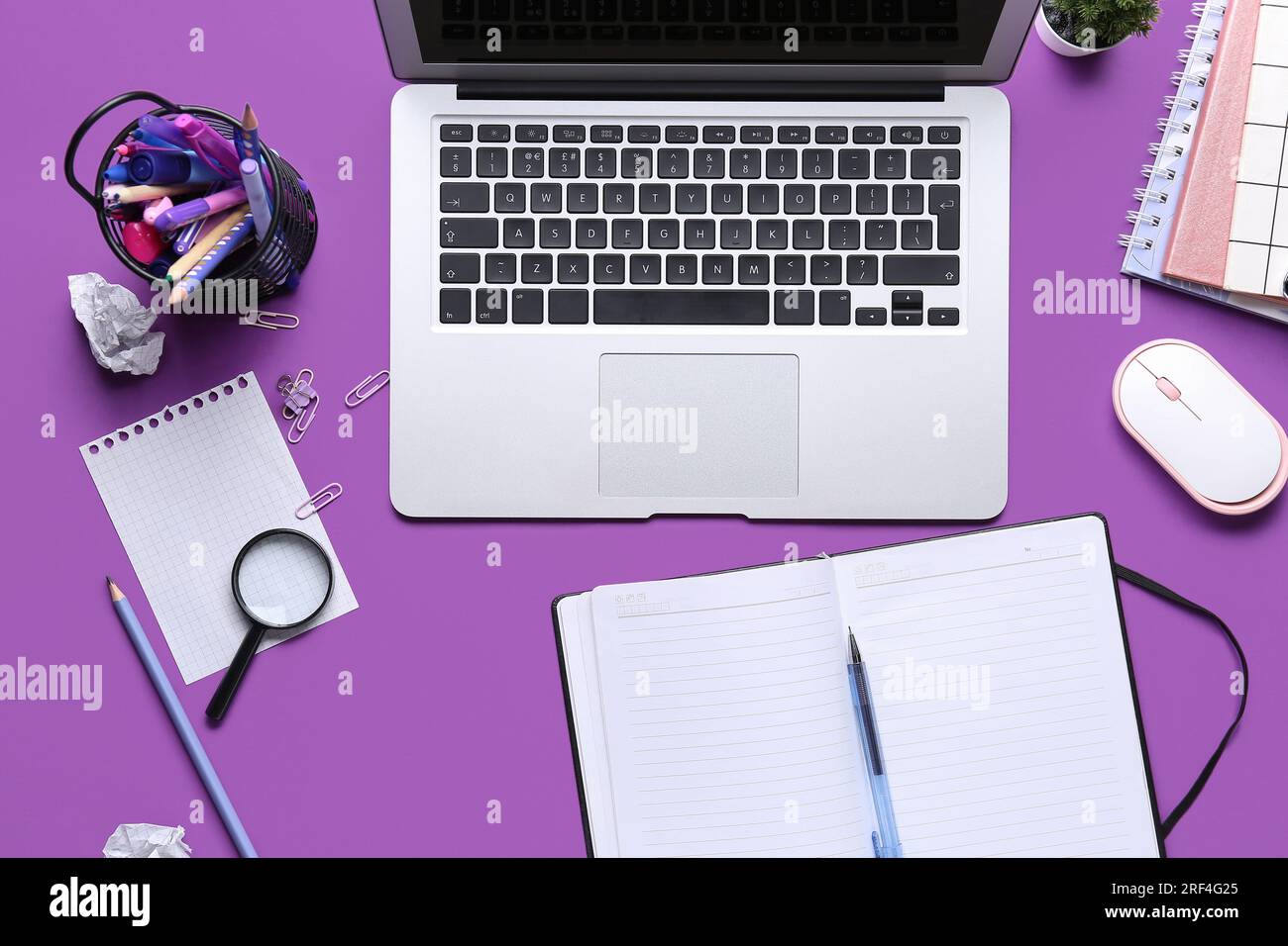 Composition with modern laptop, computer mouse and different stationery ...