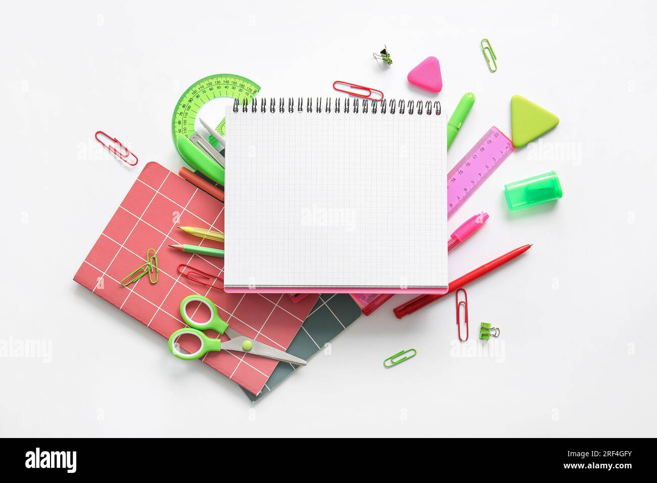 Composition with blank notebook and different school stationery on ...